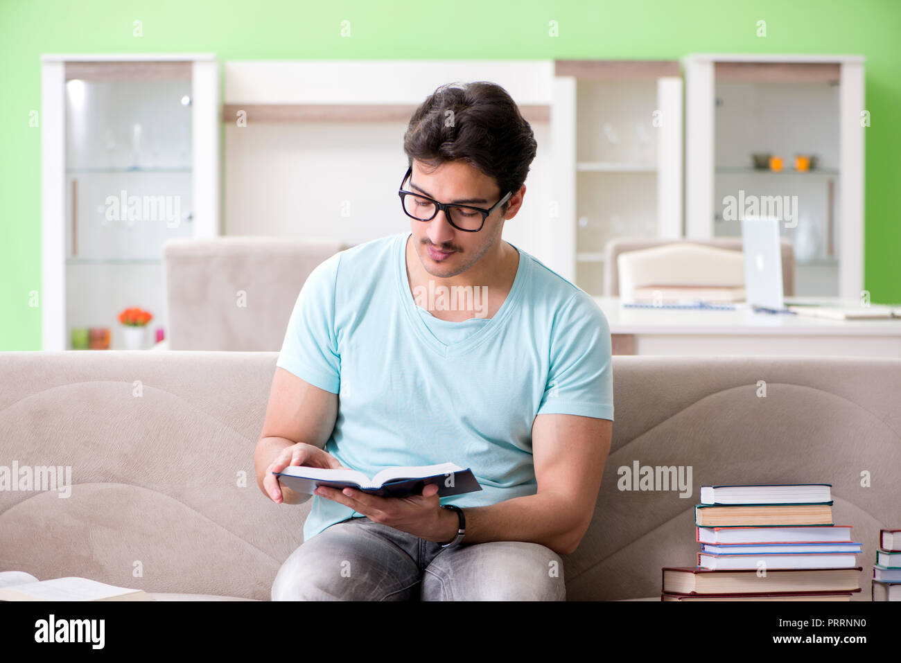 Student preparing for university exams at home Stock Photo - Alamy