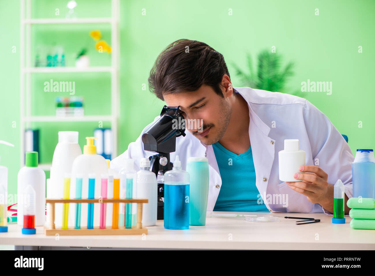 Chemist testing soap in hi-res stock photography and images - Alamy