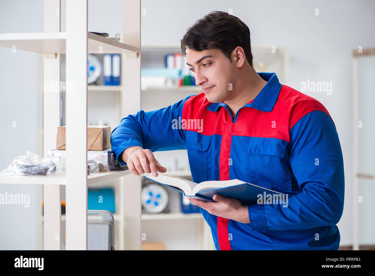 Man working in the postal warehouse Stock Photo - Alamy