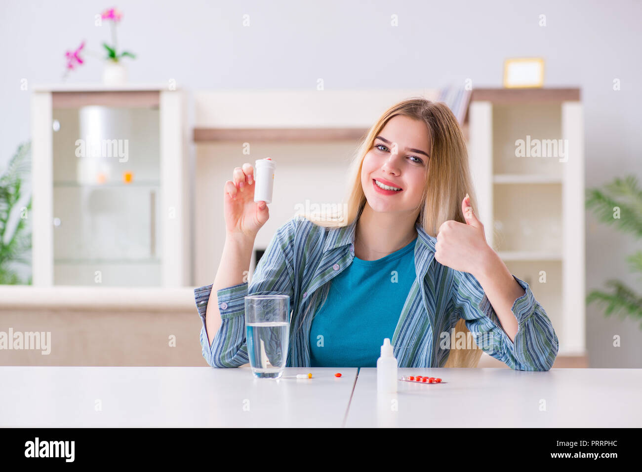Thumbs up woman pill hi-res stock photography and images - Alamy
