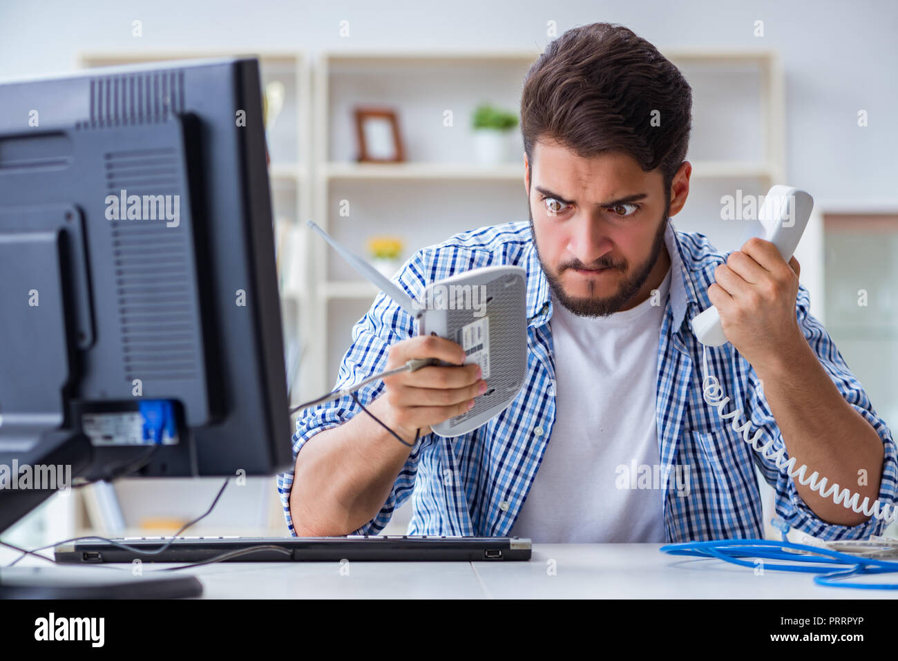 Frustrated young man due to weak internet reception Stock Photo - Alamy