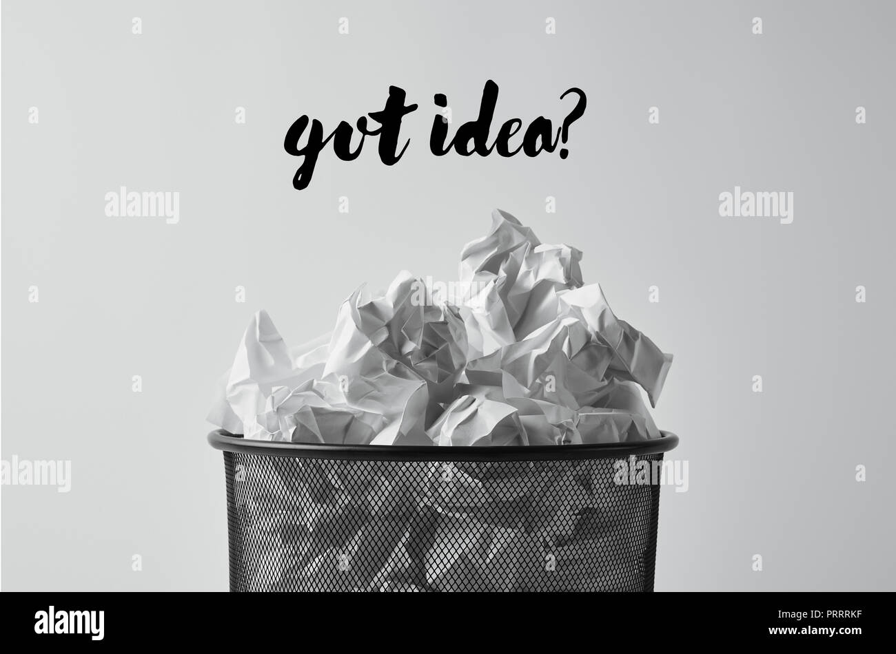 close-up shot of office trash bin with crumpled papers isolated on ...