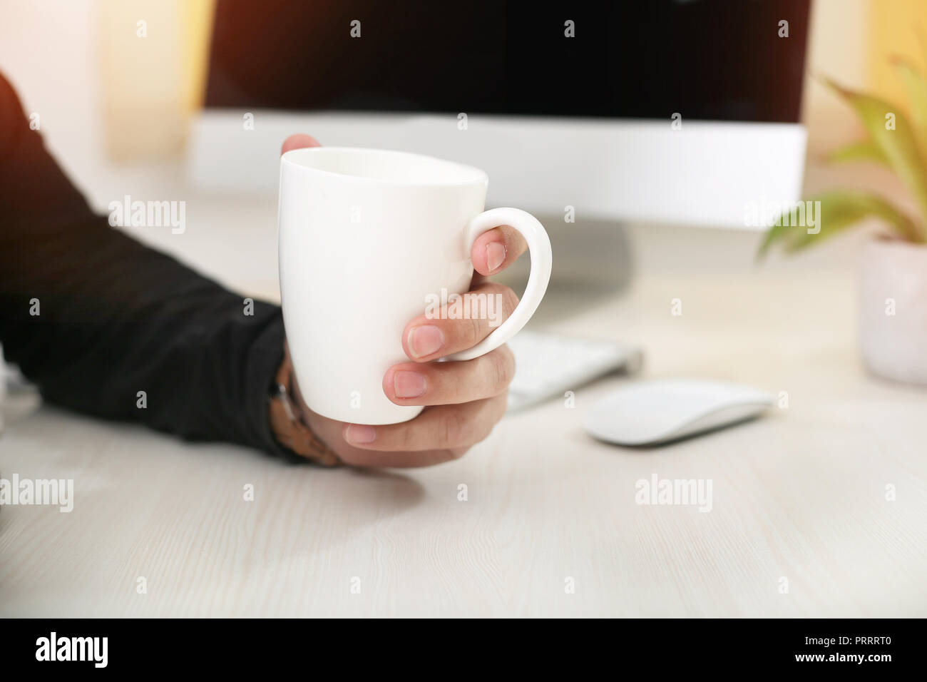 Cup in hand hi-res stock photography and images - Alamy