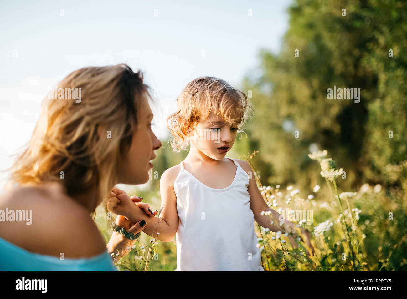 Child looking to flowers hi-res stock photography and images - Alamy