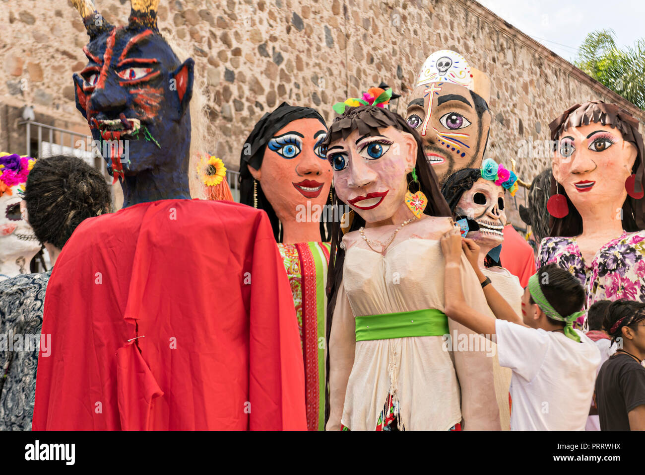 Giant paper-mache puppets called Mojigangas prepare to join in the ...