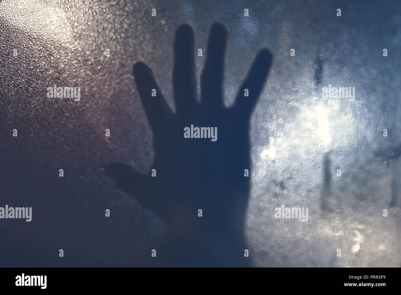 Hand on condensed window in the dark Stock Photo - Alamy
