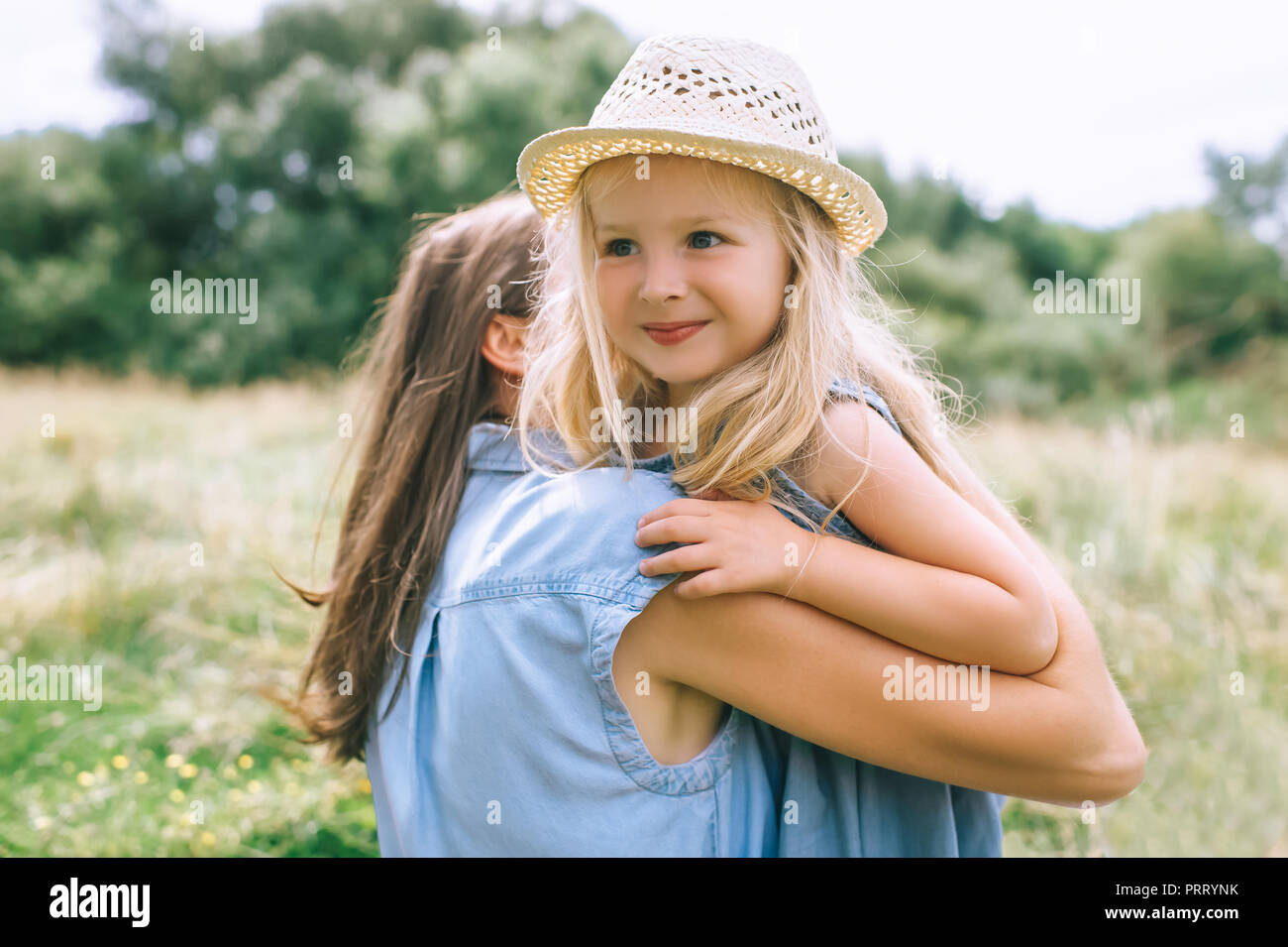 Child girl summer kid nature hugging hi-res stock photography and ...