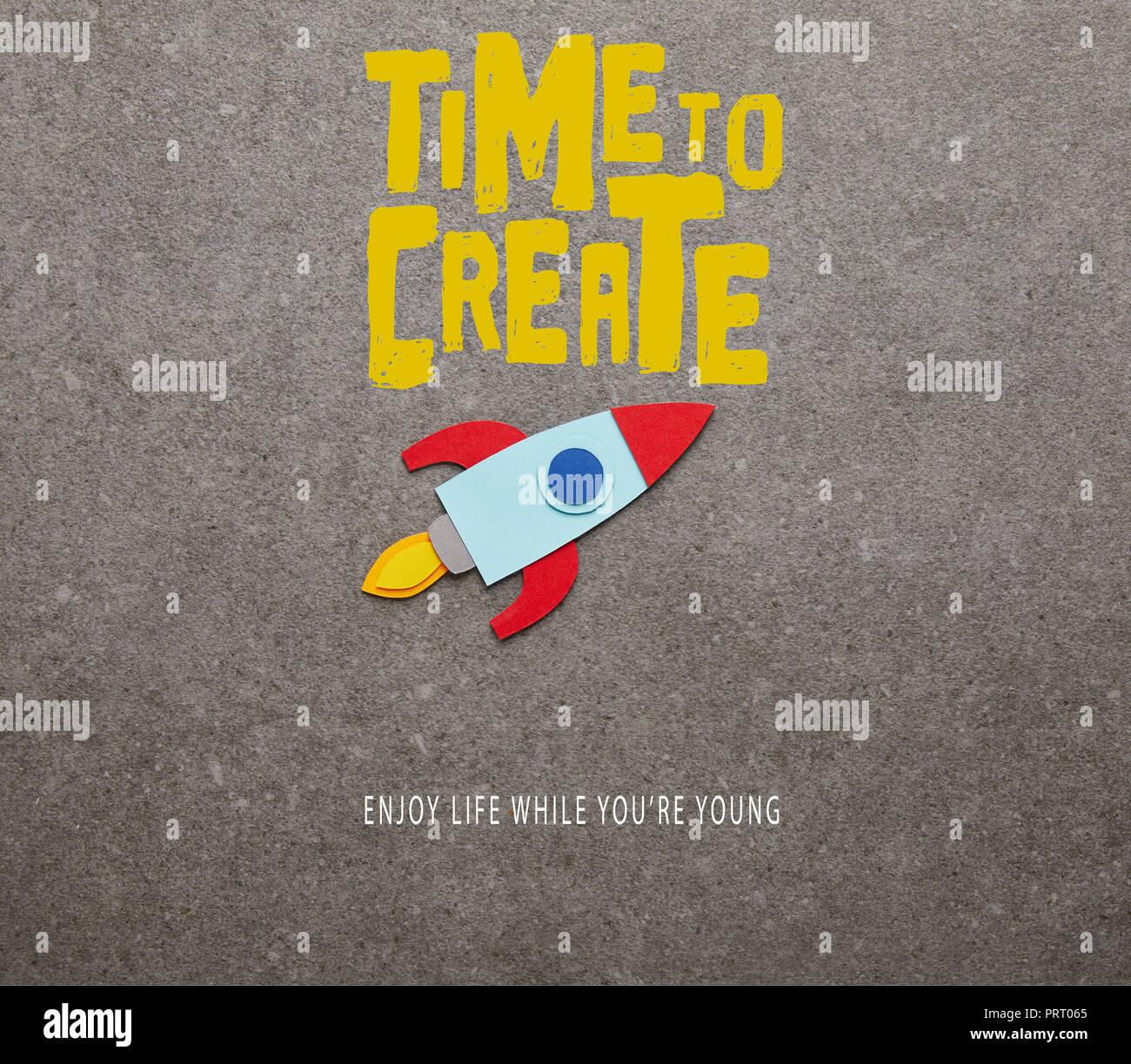 colorful handmade rocket on gray background with "time to create ...