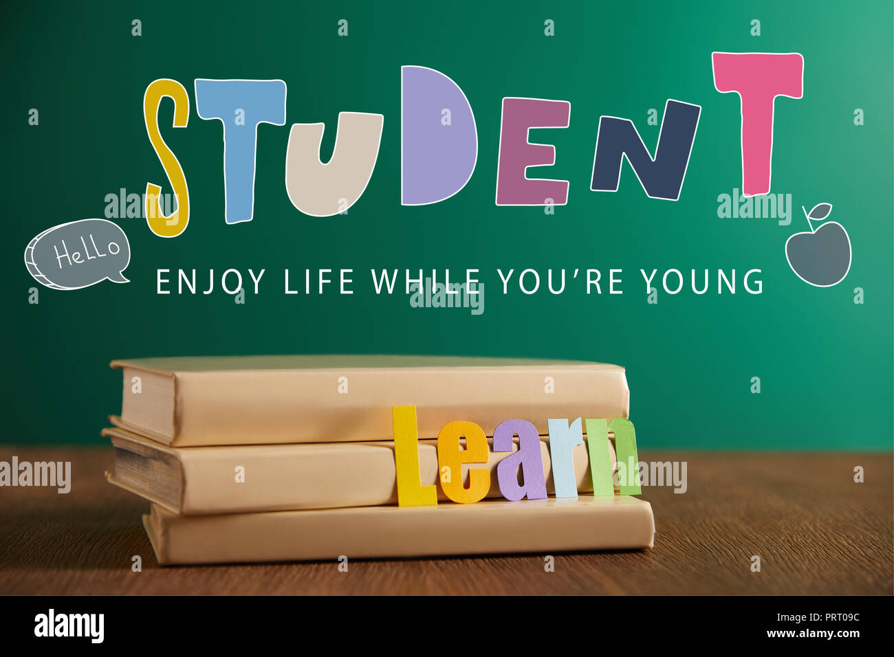 books with learn sign, chalkboard with with "student - enjoy life while ...