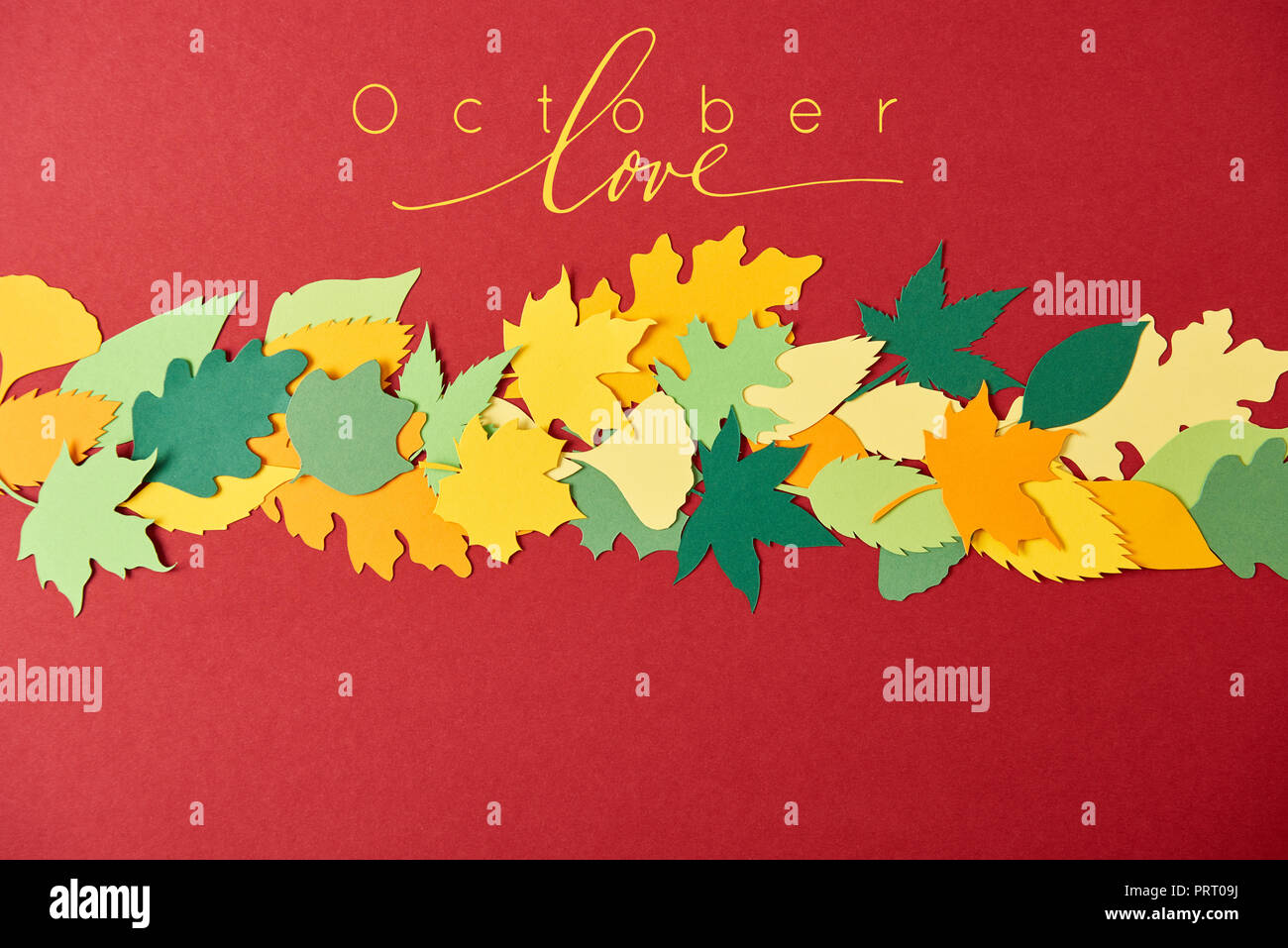 flat lay with colorful papercrafted leaves with "october love ...