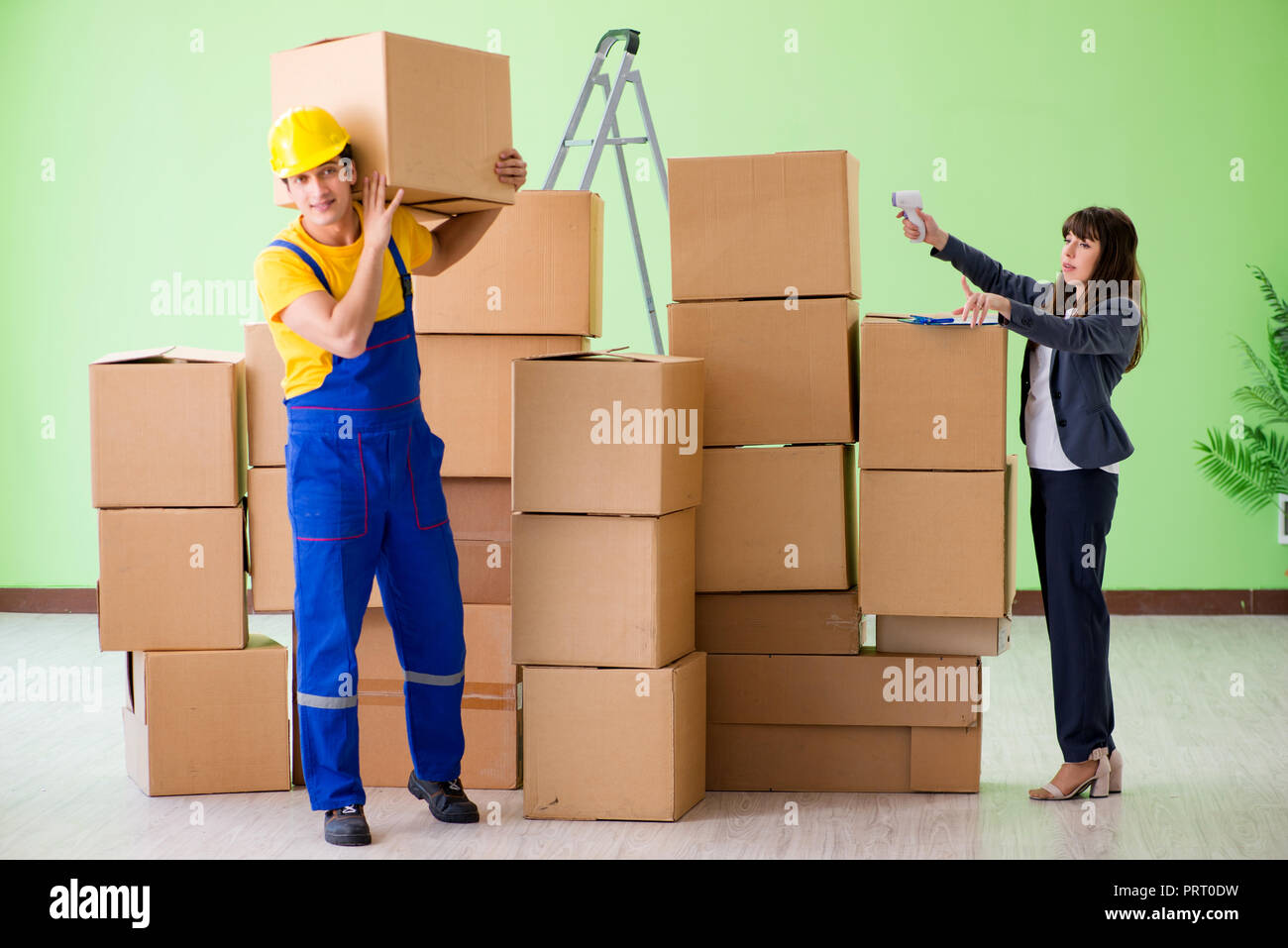 Woman boss and man contractor working with boxes delivery Stock Photo ...