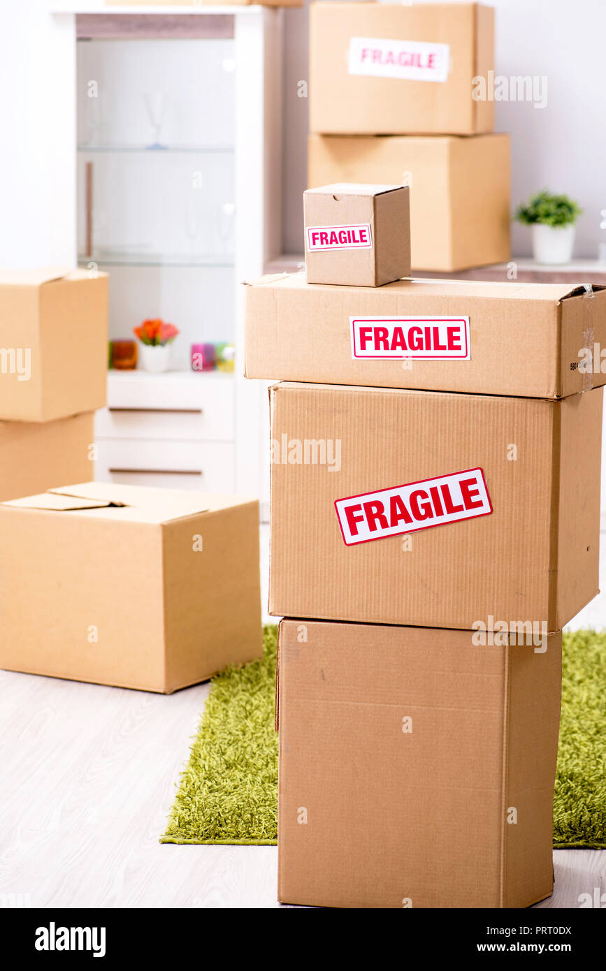 Transportation contractor with fragile boxes Stock Photo - Alamy
