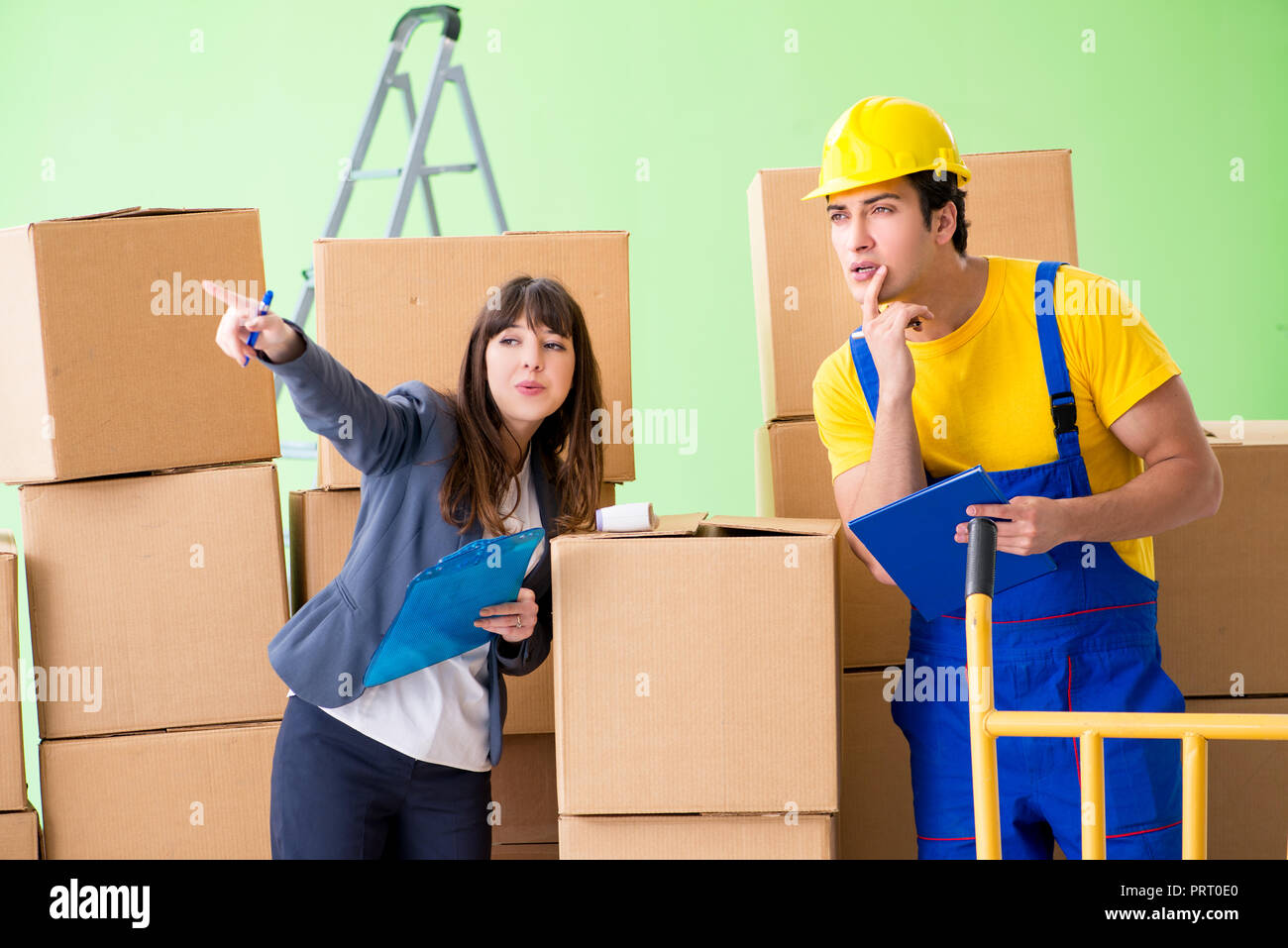 Woman boss and man contractor working with boxes delivery Stock Photo ...