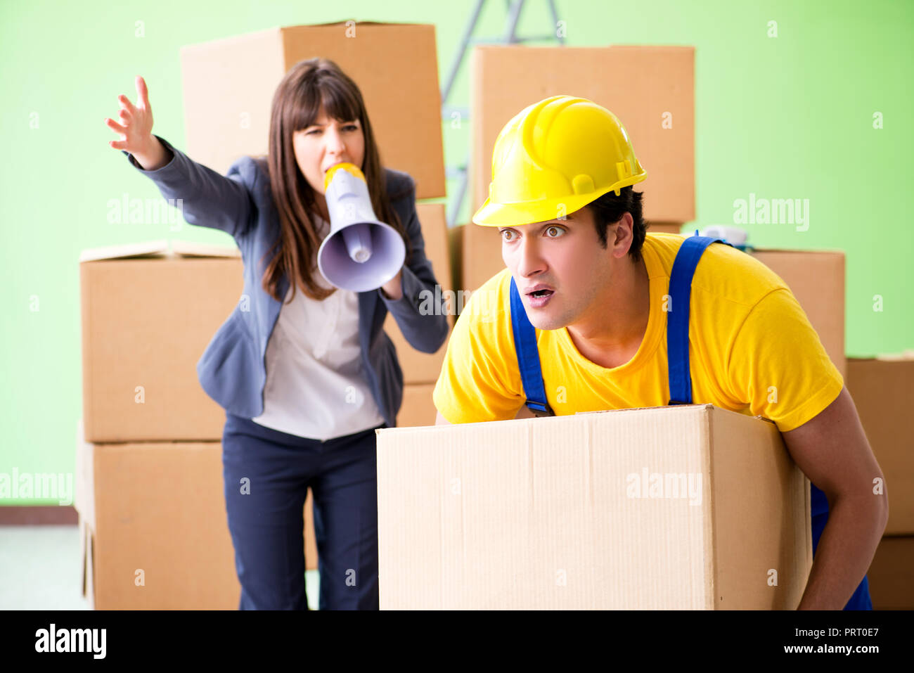 Woman boss and man contractor working with boxes delivery Stock Photo ...