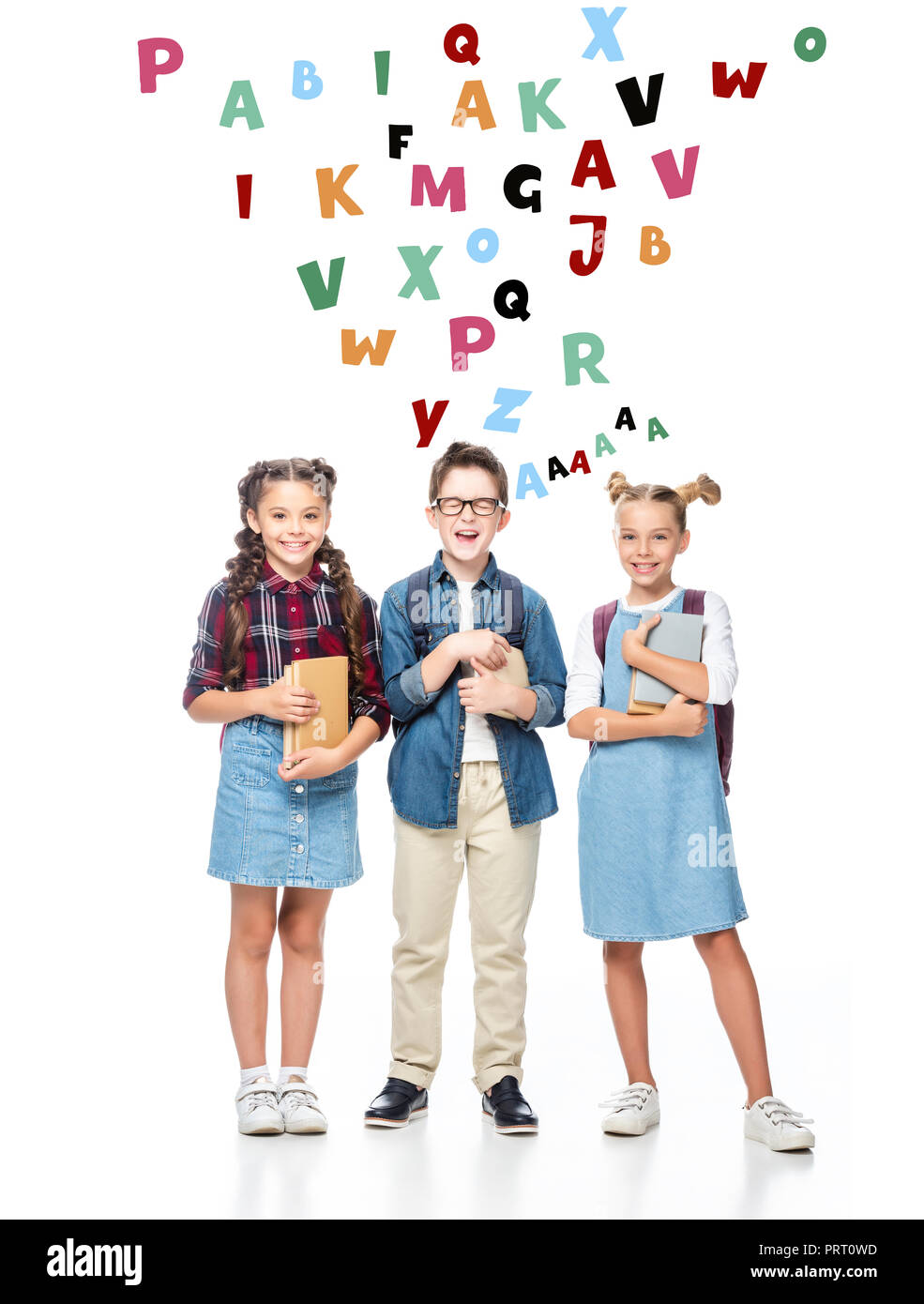 happy classmates holding books and looking at camera isolated on white ...