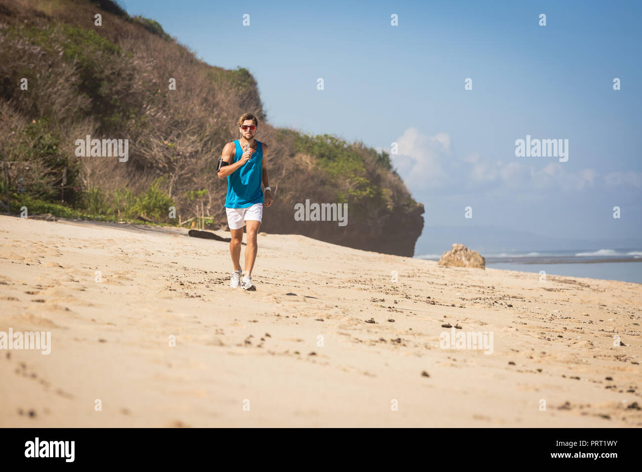 Sportive people jogging on beach hi-res stock photography and images ...
