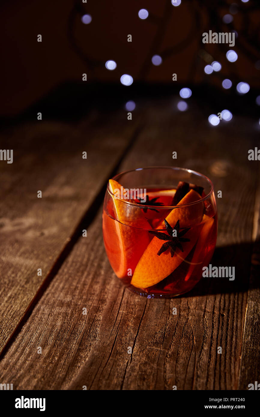 close up view of hot mulled wine drink with orange pieces and anise ...