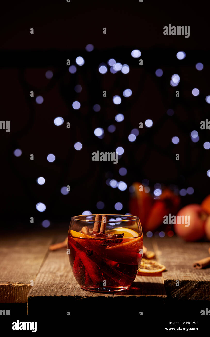 close up view of hot mulled wine drink with orange pieces and anise ...