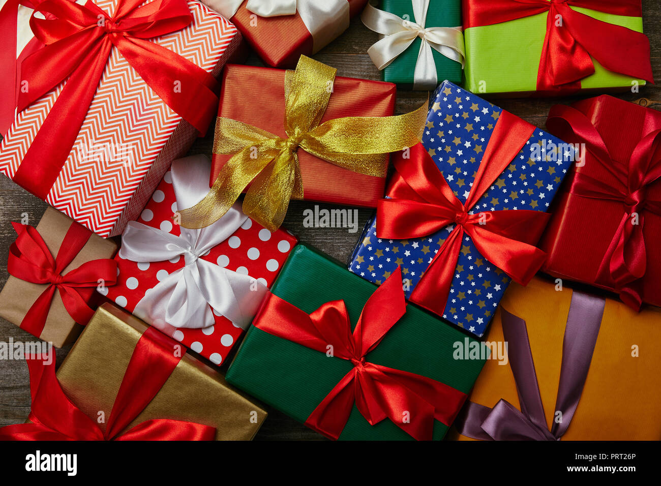 flat lay with christmas presents wrapped in different wrapping papers ...