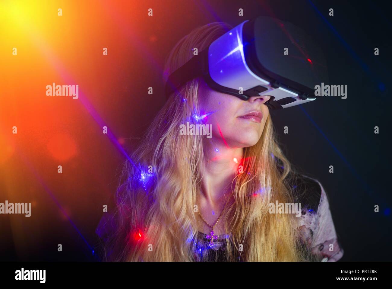 Young woman wearing VR headset Stock Photo - Alamy