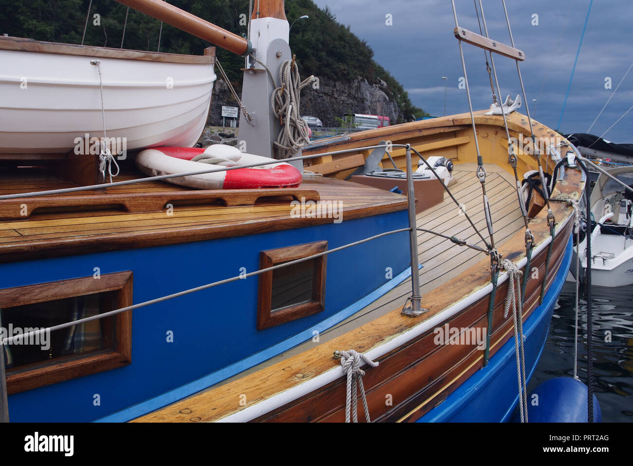 A newly refurbished timber boat beautifully restored and painted a deep ...