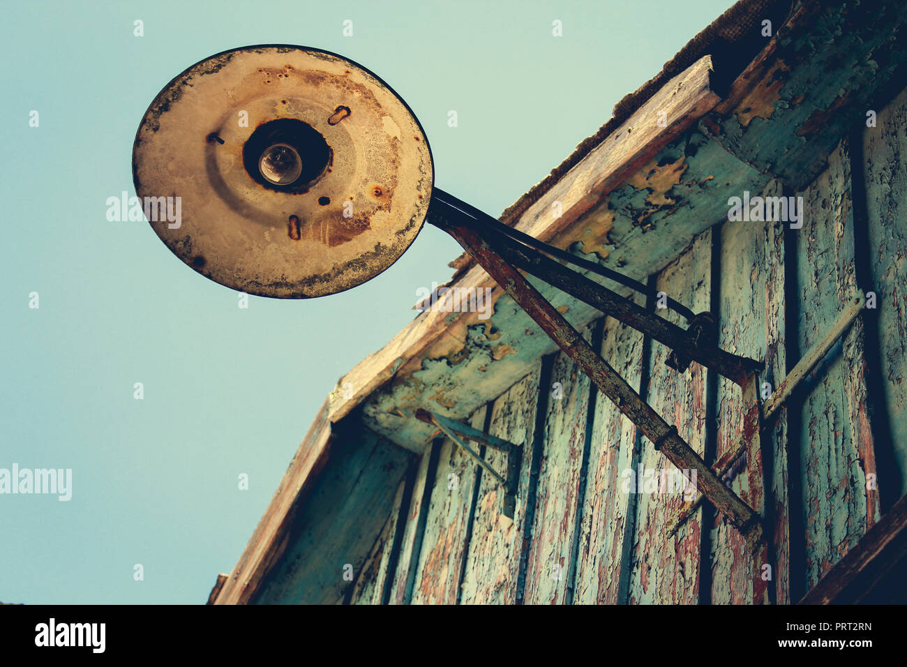 Old street lamp on roof. Toned image Stock Photo - Alamy