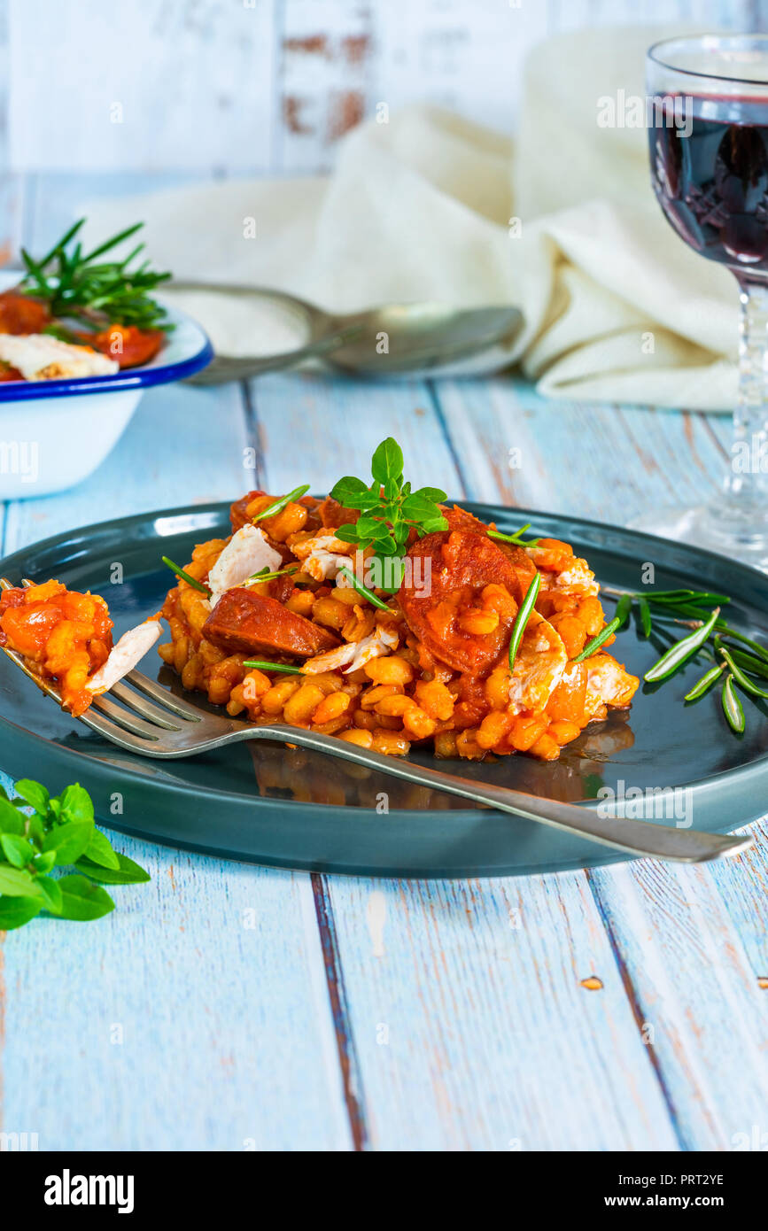 Chorizo, chicken and rosemary pearl barley risotto - top view Stock ...