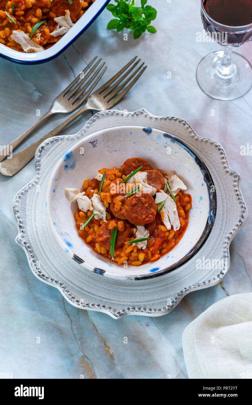 Chorizo, chicken and rosemary pearl barley risotto - top view Stock ...