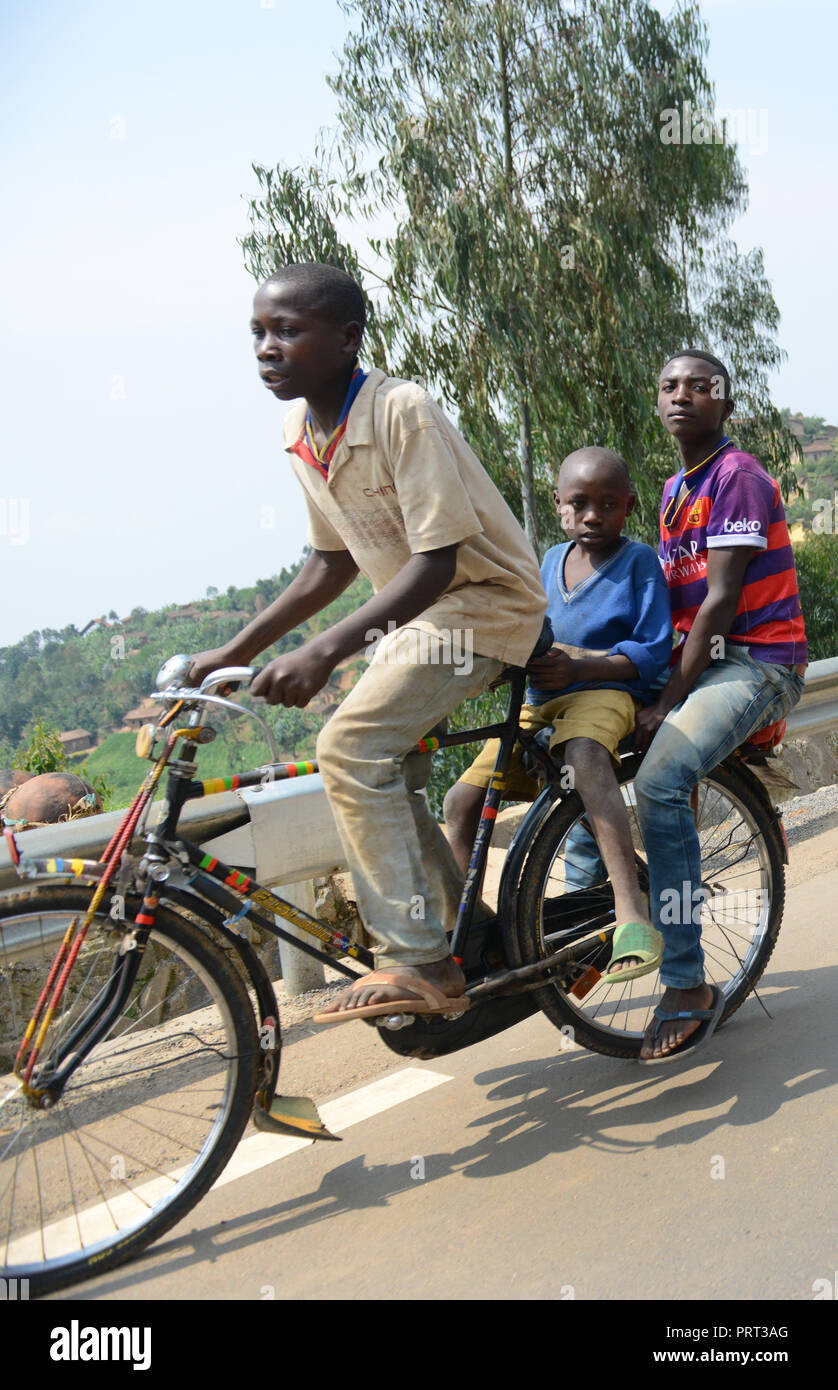 Rwandan boys on a bicycle in rural Rwanda Stock Photo - Alamy