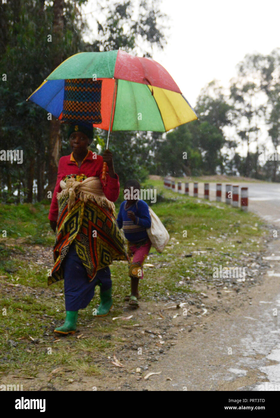 walking in the rain in rural Rwanda Stock Photo - Alamy