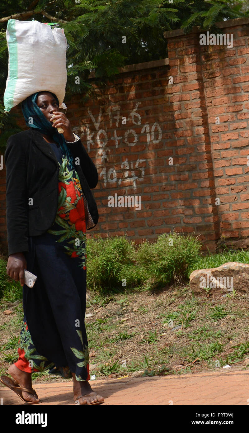 Woman carrying sack hi-res stock photography and images - Alamy