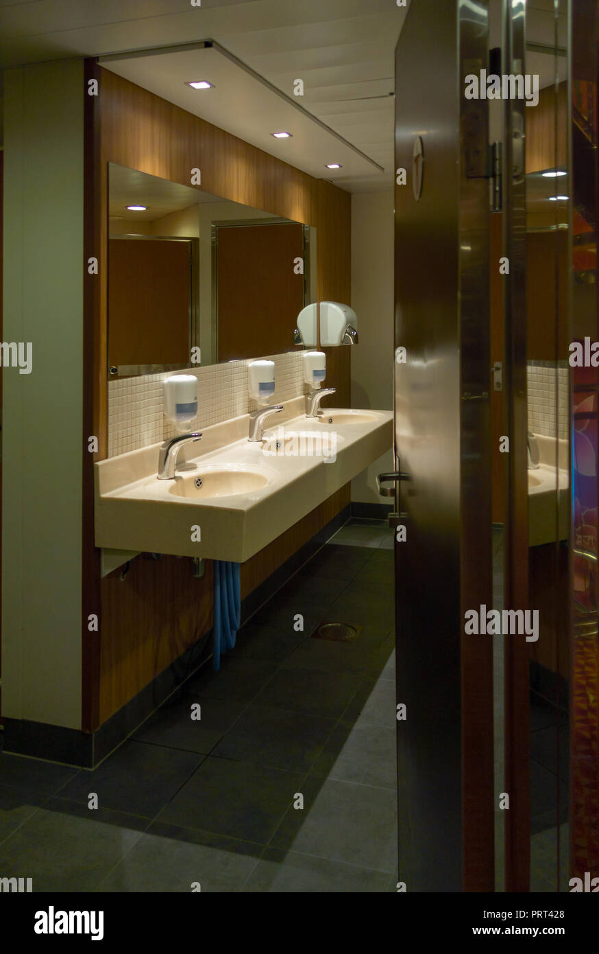 An empty public toilet at a ship with door open Stock Photo - Alamy