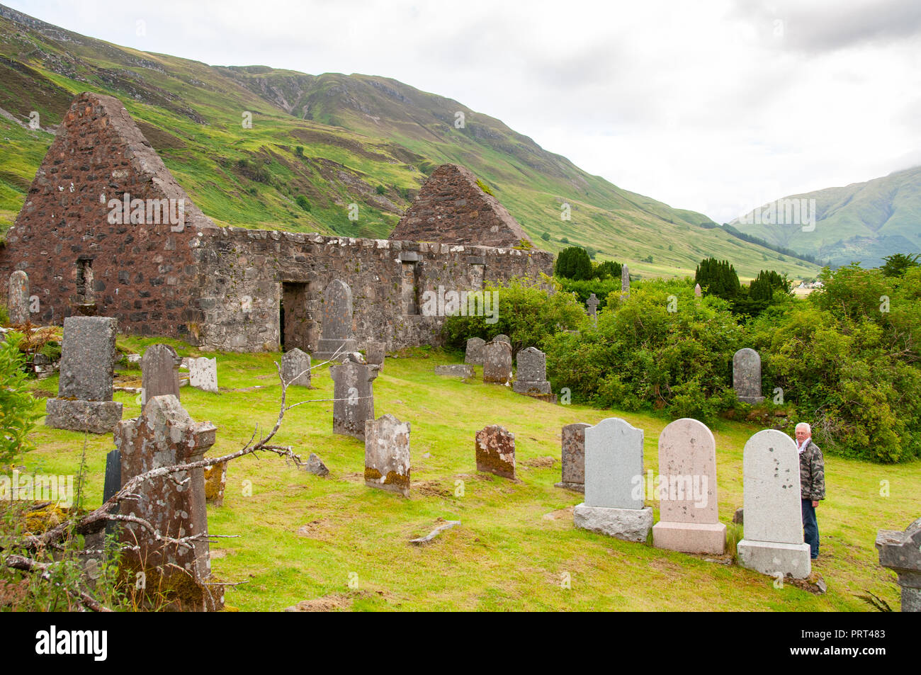 old man looking at a grave in crumbling stone ruins of barns, stone ...
