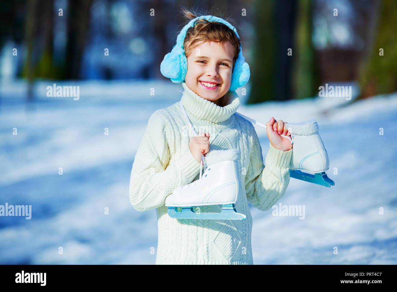 happy cute boy going ice skating outdoor in the winter park Stock Photo ...