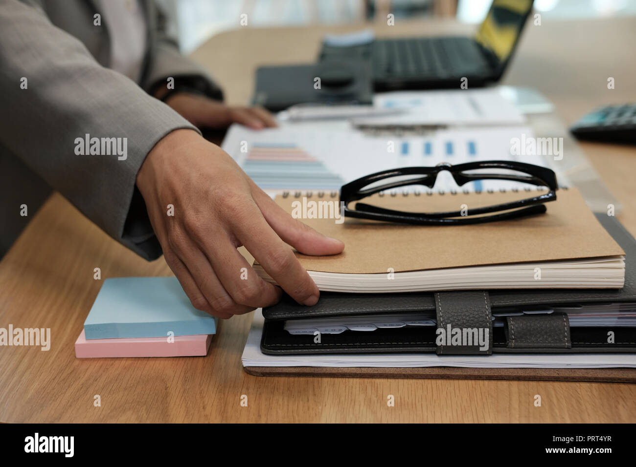 Hand picking up paper hi-res stock photography and images - Alamy