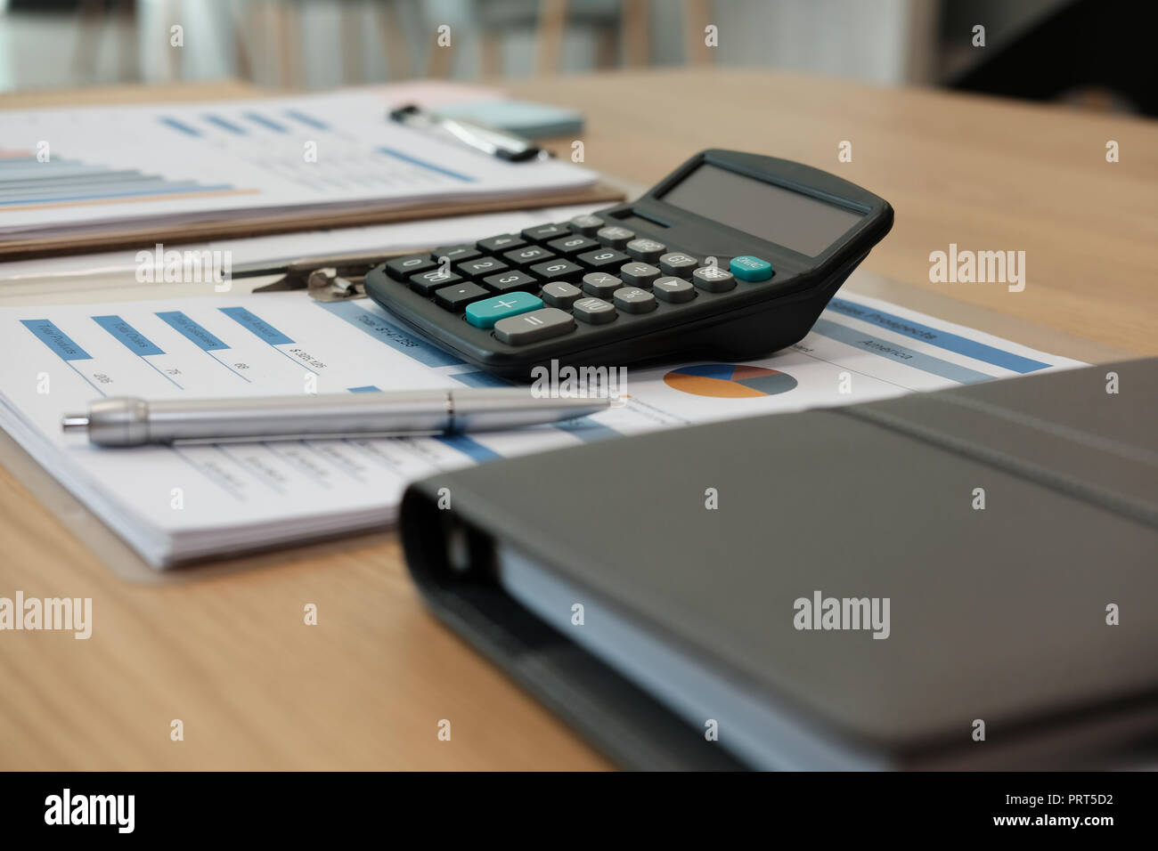 calculator, business document on wood desk at office workplace ...