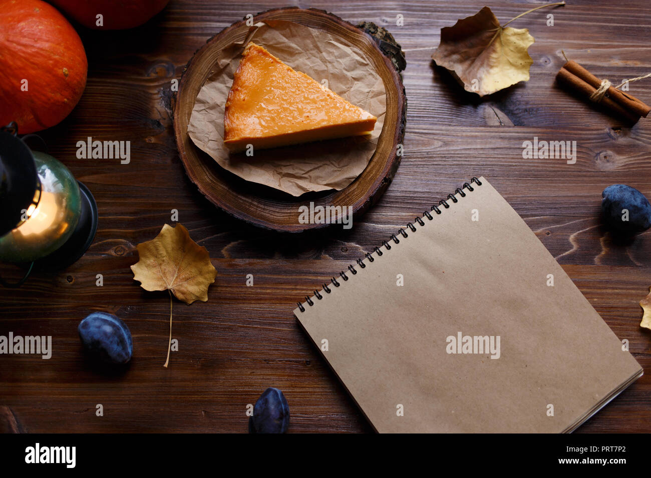 Notebook, pumpkin cheesecake, cooked at home, pumpkin, foliage, table ...