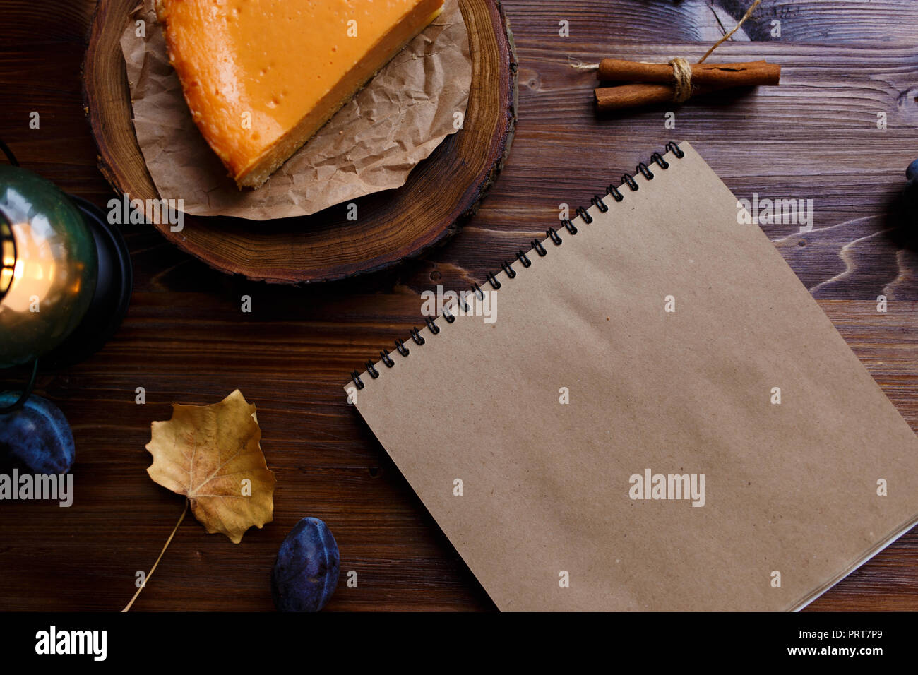 Notebook, pumpkin cheesecake, cooked at home, pumpkin, foliage, table ...