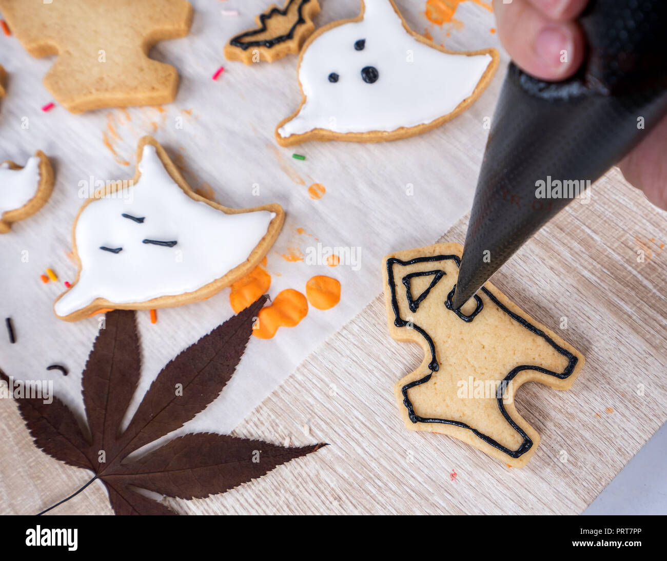 Fresh homemade decorating halloween dessert with ghost, creeping spider ...