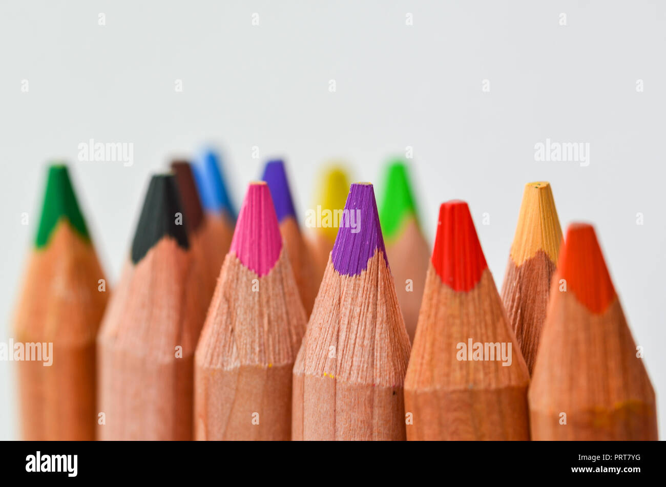 View of different colored crayons on white background Stock Photo - Alamy