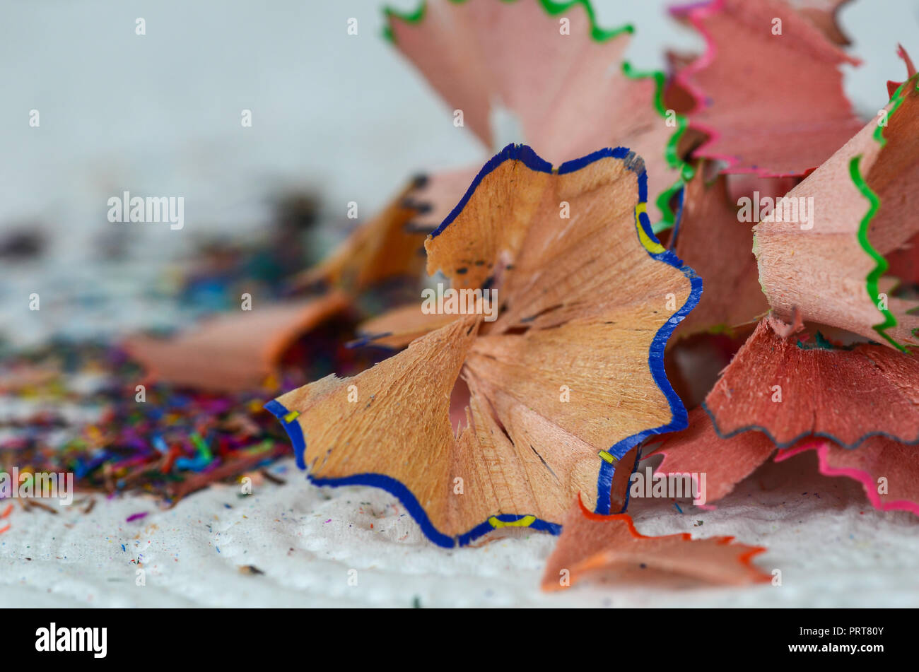 Shavings of sharpening colorful pencils on white table, close up Stock ...