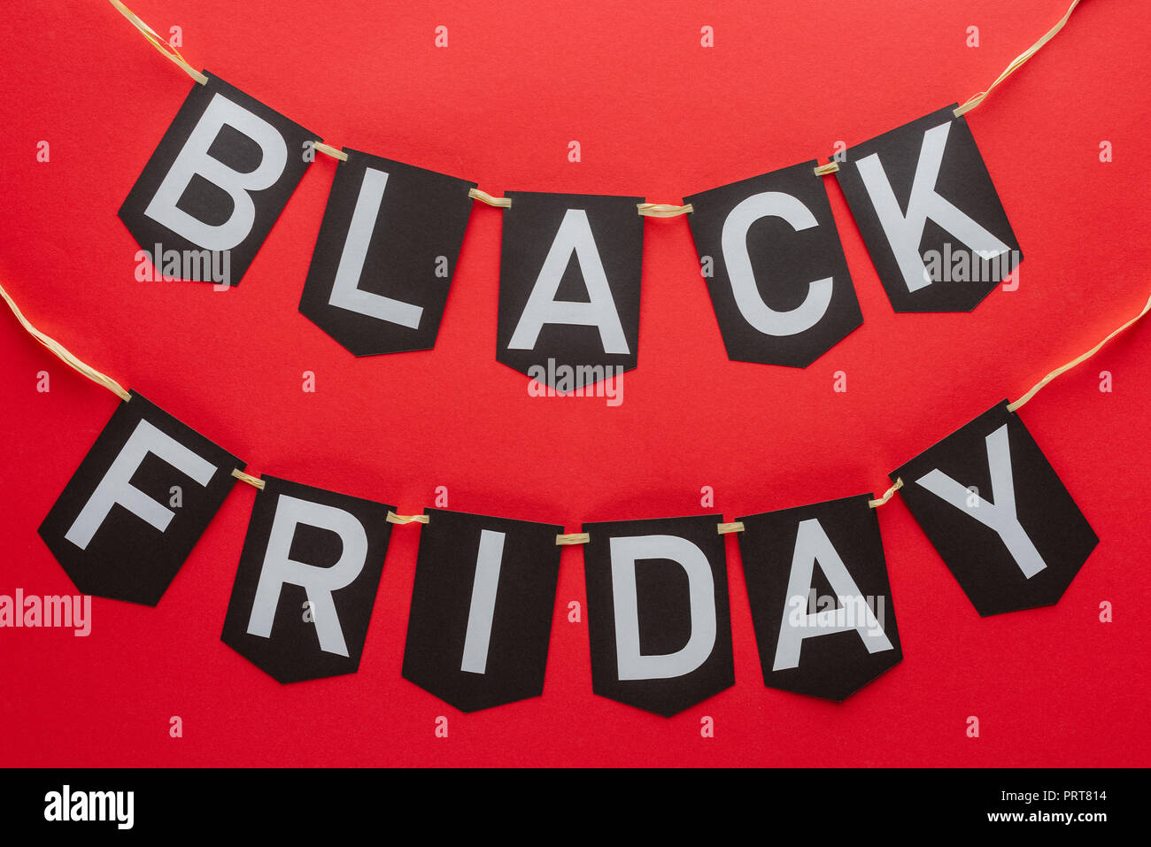 black friday words on flag garlands isolated on red Stock Photo - Alamy