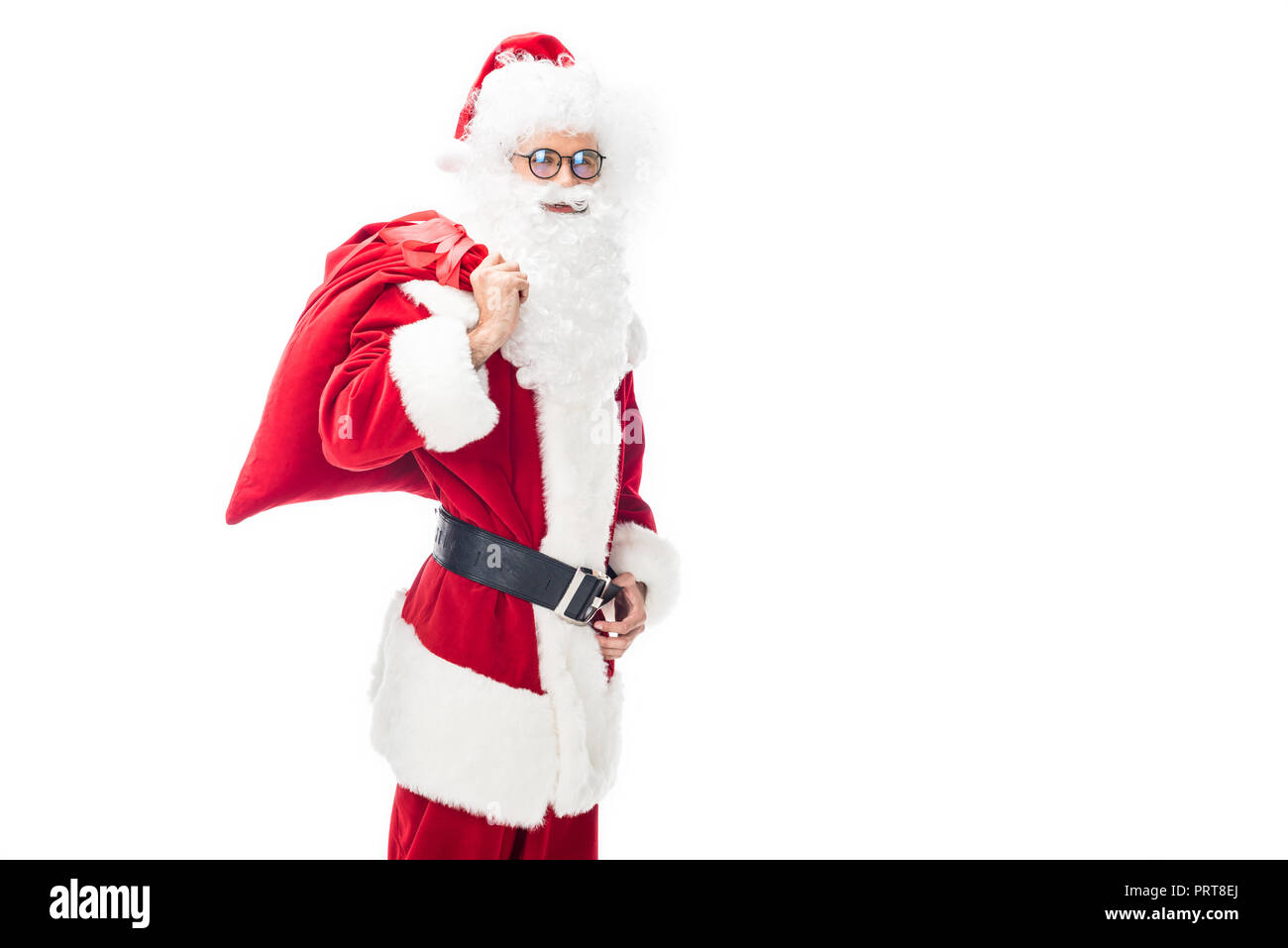 cheerful santa claus in eyeglasses holding christmas sack over shoulder ...