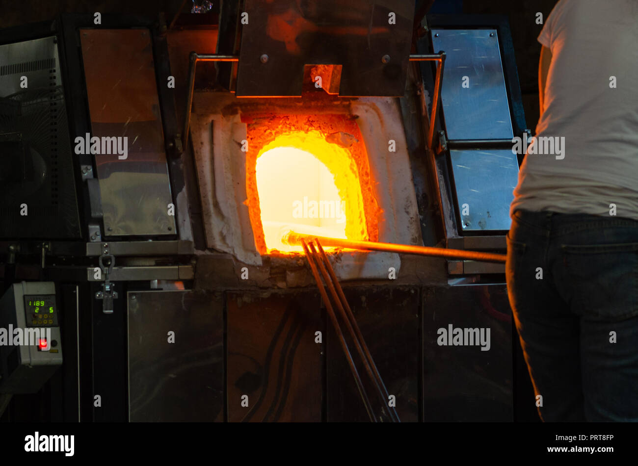 Manufacturing glass in a traditional oven Stock Photo - Alamy