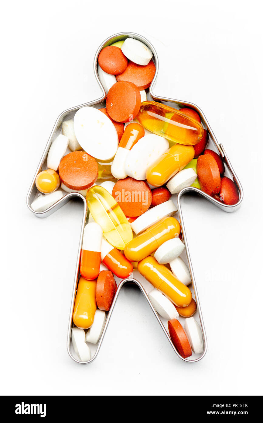 pills in a male shape on white background, isolated Stock Photo - Alamy