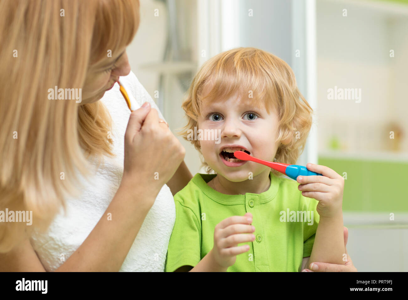Mother And Child Boy Brushing Teeth Together Stock Photo - Alamy