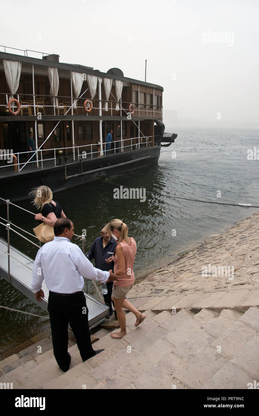 Tourists board the antique steamship MS Sudan during a sandstorm, while ...