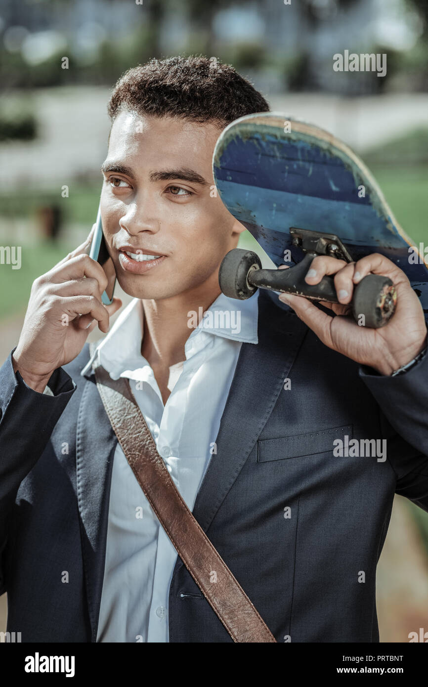 Thoughtful male student finishing his classes today Stock Photo - Alamy