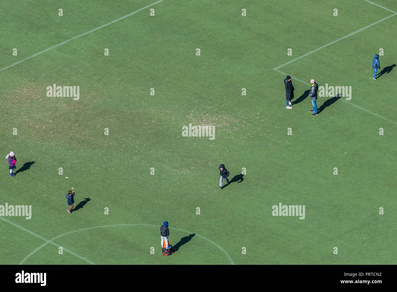 Aerial view of children playing on soccer field Stock Photo - Alamy