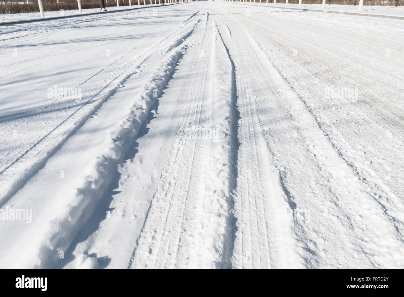 Car tire track in snow Stock Photo - Alamy